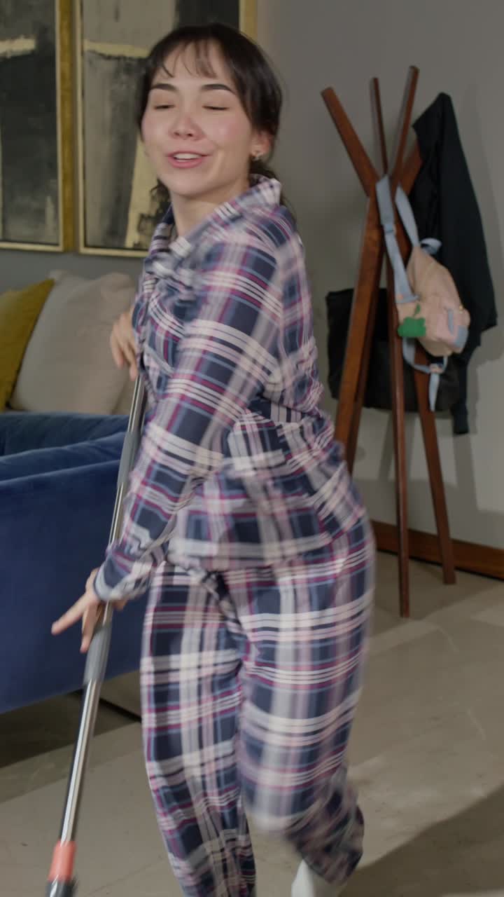 Woman Sassy Dancing While Mopping - Free Stock Video