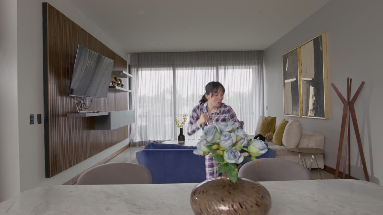 A Woman Joyfully Dancing While Mopping - Free Stock Video