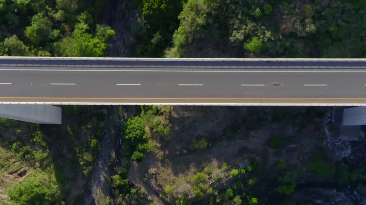 Cars crossing scenic mountain bridge. - Free Stock Video