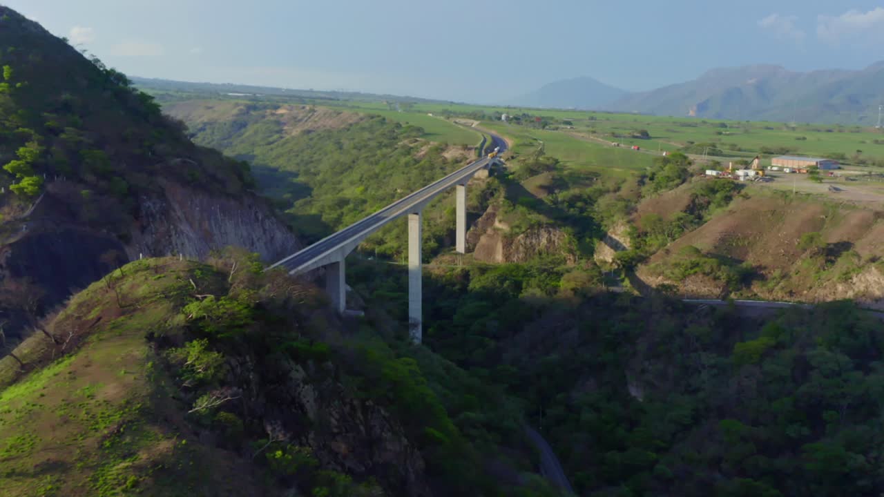 Trailers crossing a bridge over a scenic valley landscape - Free Stock ...