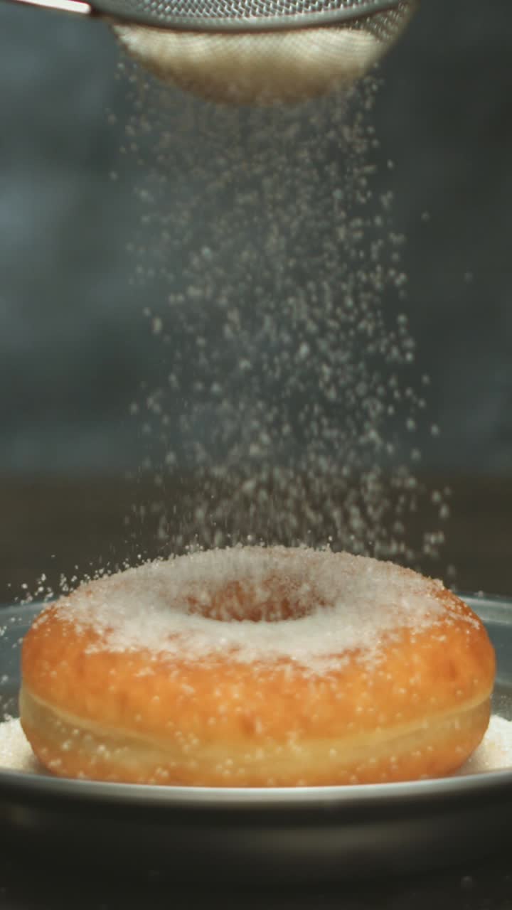 Dusting Sugar on Fresh Donut - Free Stock Video