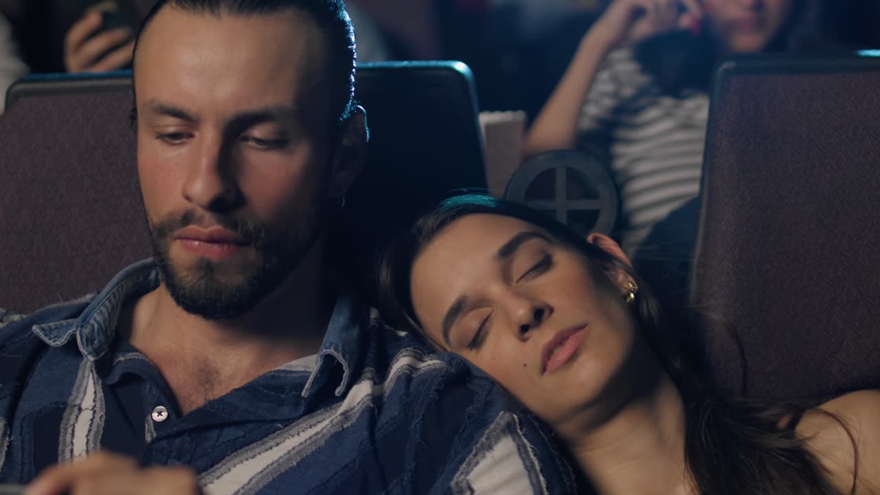 Couple seated with woman resting her head on man's shoulder - Free ...