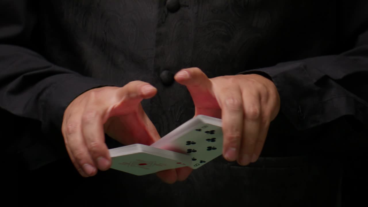 Shuffling Playing Cards in Hands - Free Stock Video