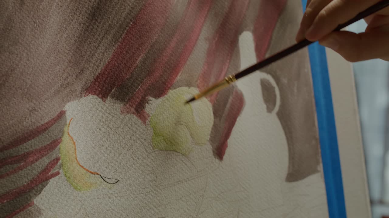 Painter's Hand Softly Brushing a Canvas - Free Stock Video