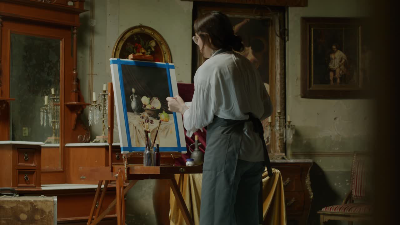 Artist Painting in a Classical Studio Setting - Free Stock Video