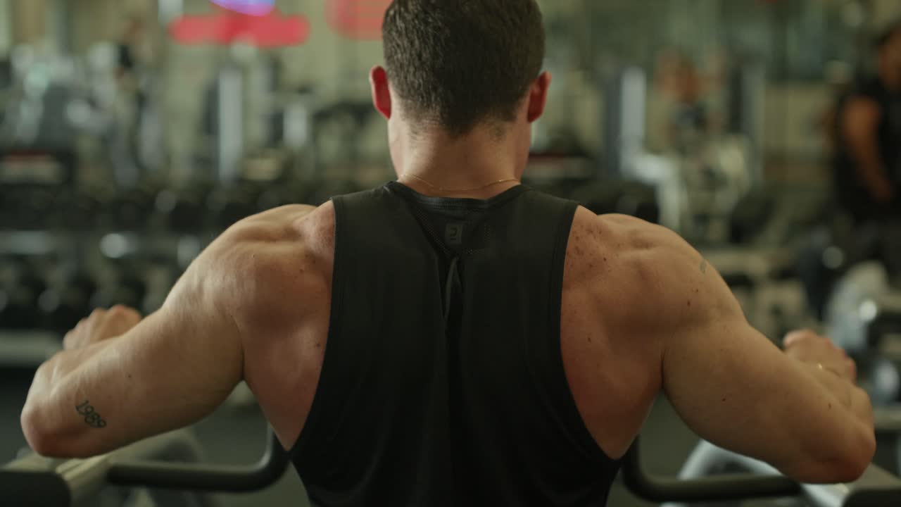 Man exercising on gym equipment - Free Stock Video