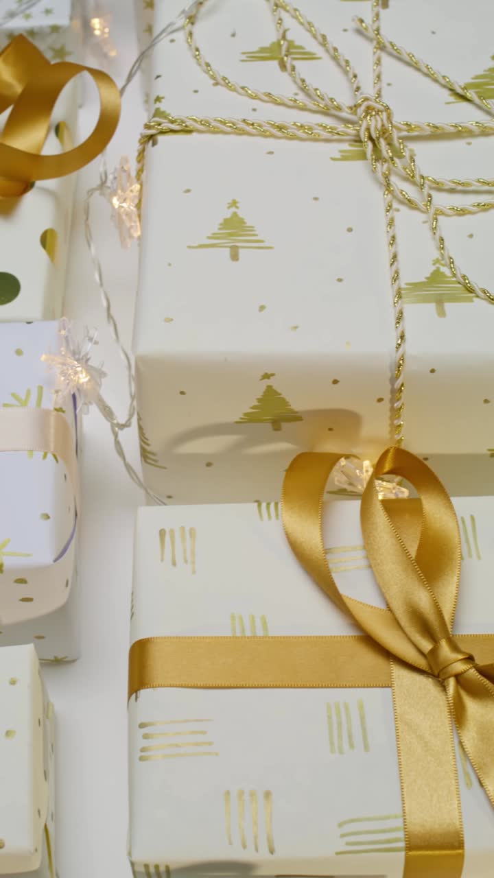 Vertical video of an assortment gifts wrapped with elegant with ...