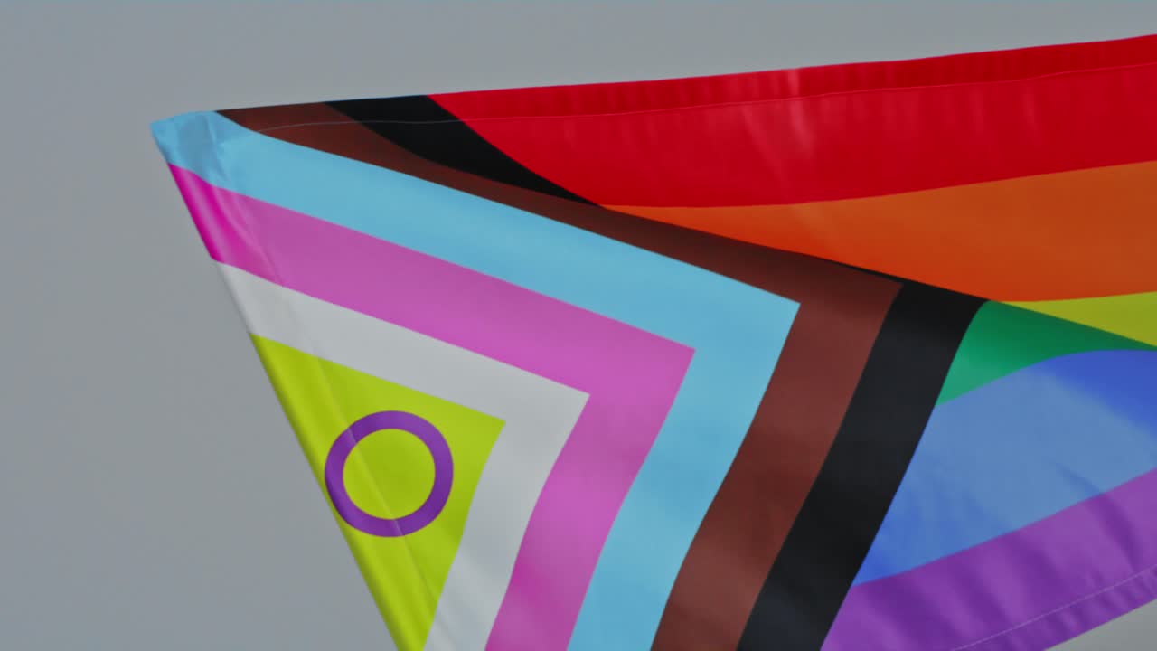 Progress pride flag with inclusive colors and patterns gently moving ...