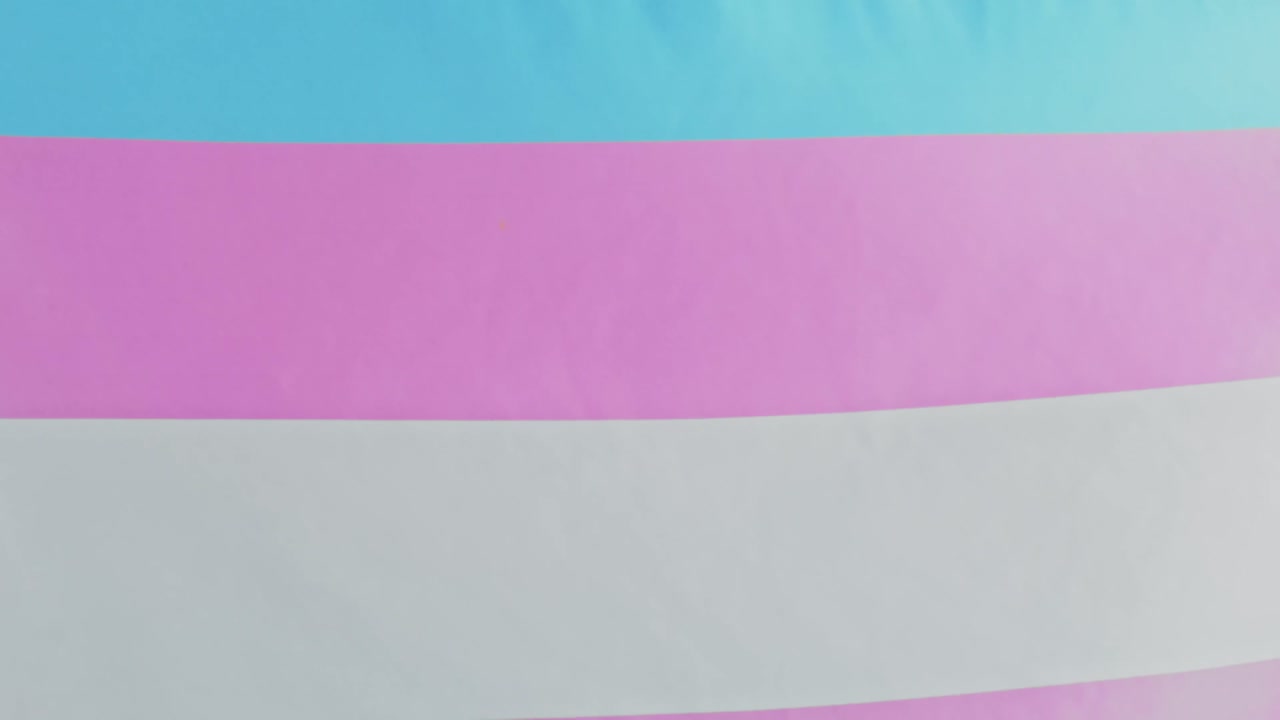 Close up of a transgender flag gently waving - Free Stock Video