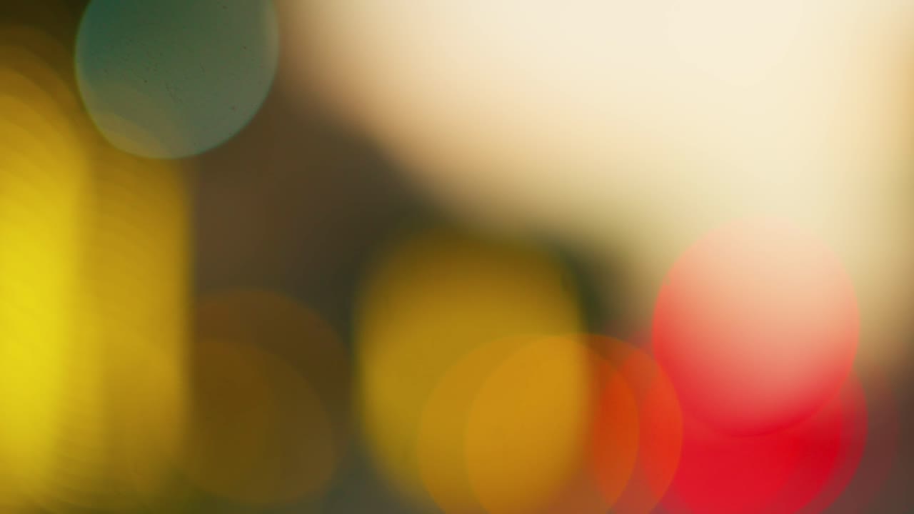 Blurred lights create a vibrant bokeh effect - Free Stock Video
