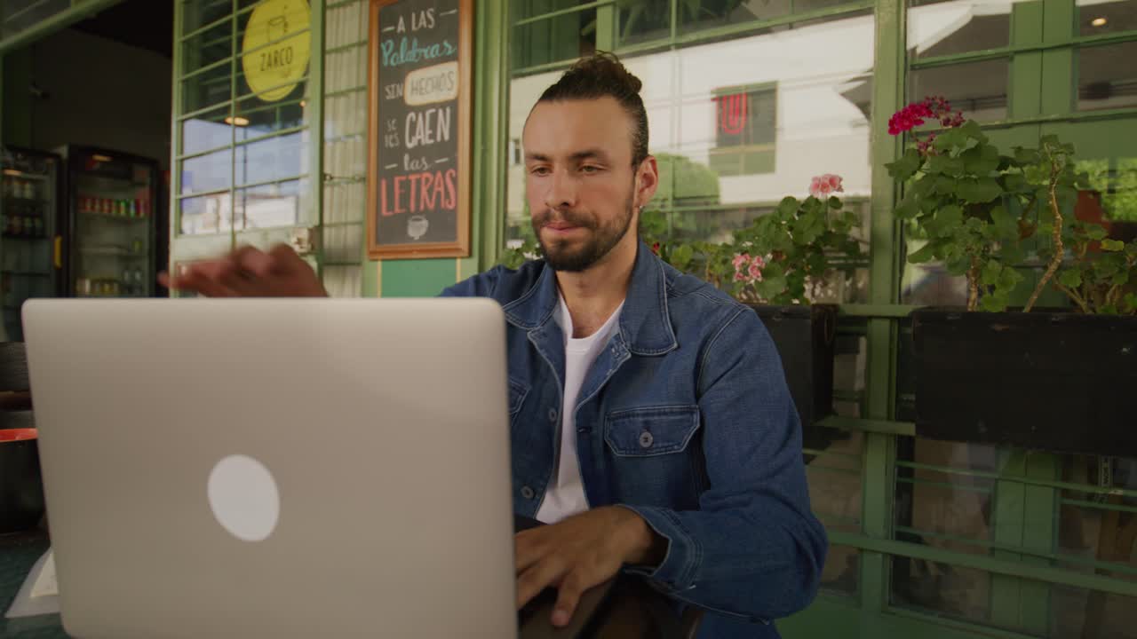 A young man closes his laptop and stores it on a secure laptop ...