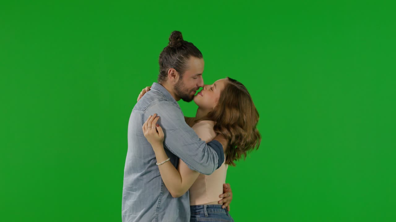 Couple Sharing a Kiss on Green Screen - Free Stock Video