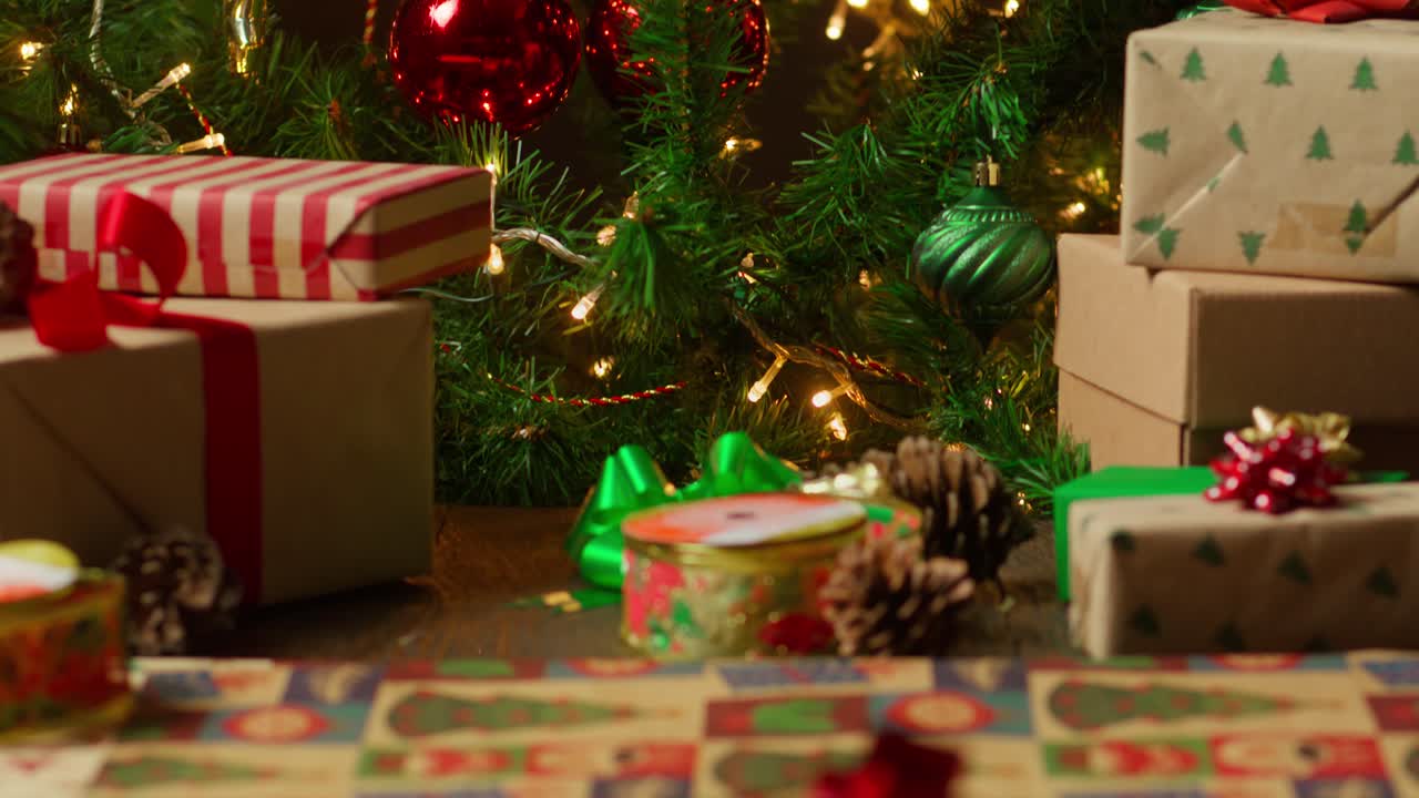 Hands Taping a Bow on Christmas Present - Free Stock Video