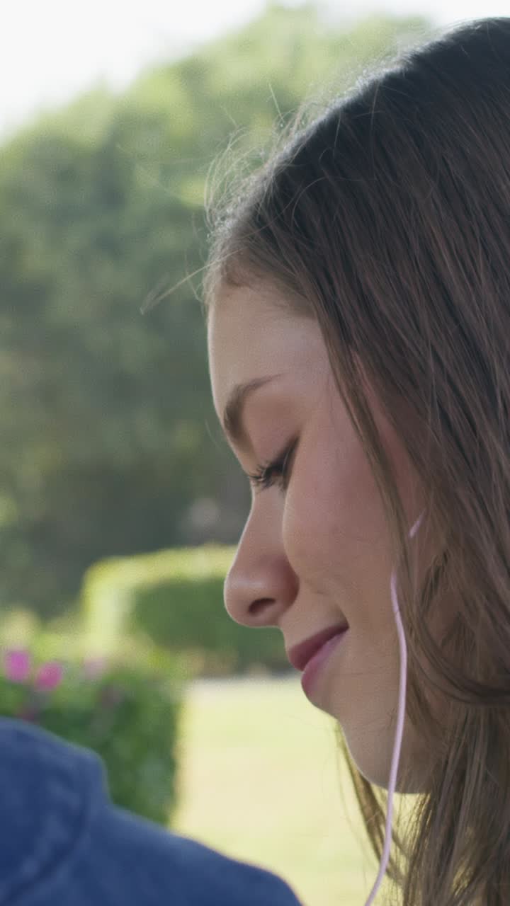 Vertical video of a young couple sharing a heartfelt and emotional kiss ...