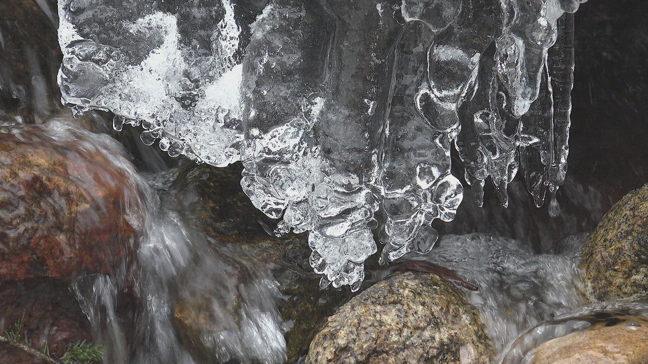 Melting ice and water stream - Free Stock Video