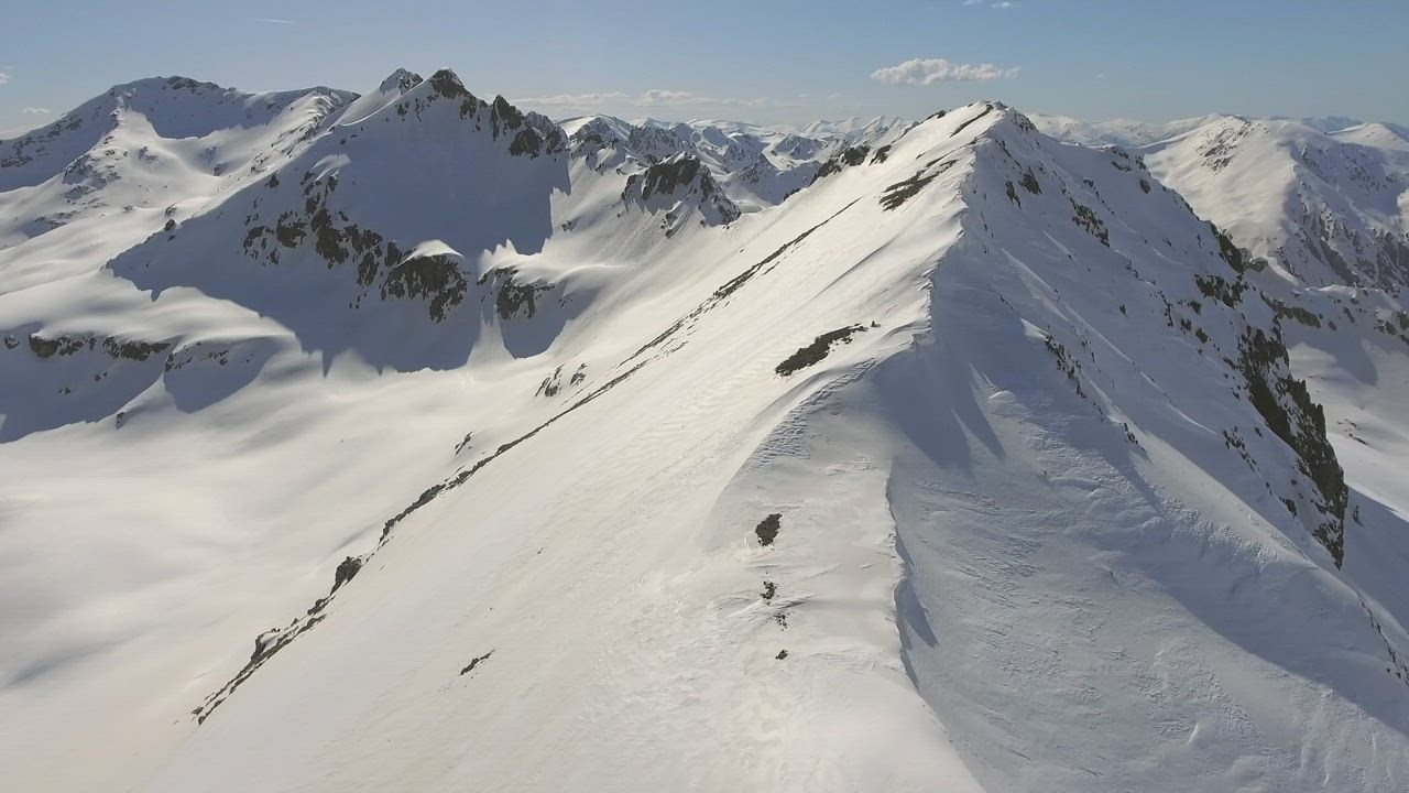 Sharp mountain peaks covered in snow - Free Stock Video