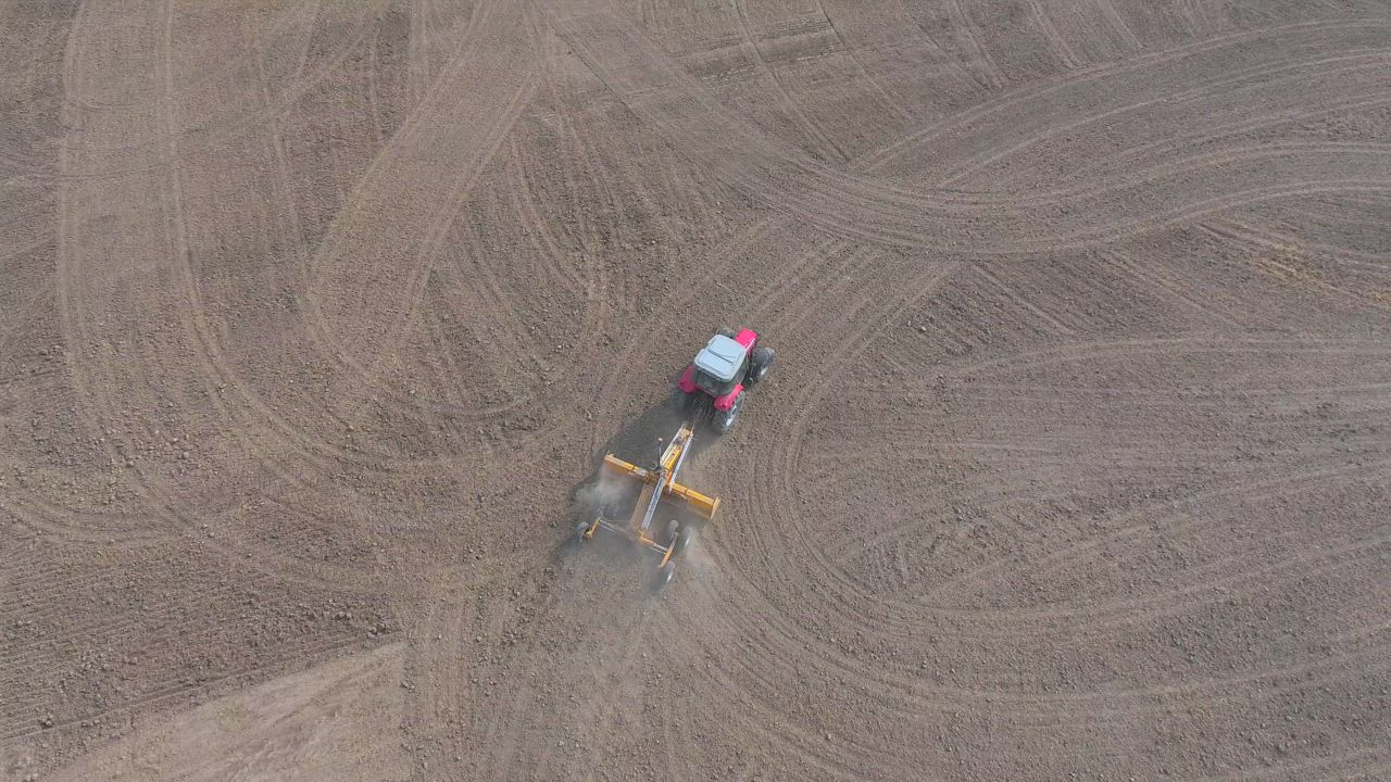 Tractor preparing the agricultural ground - Free Stock Video
