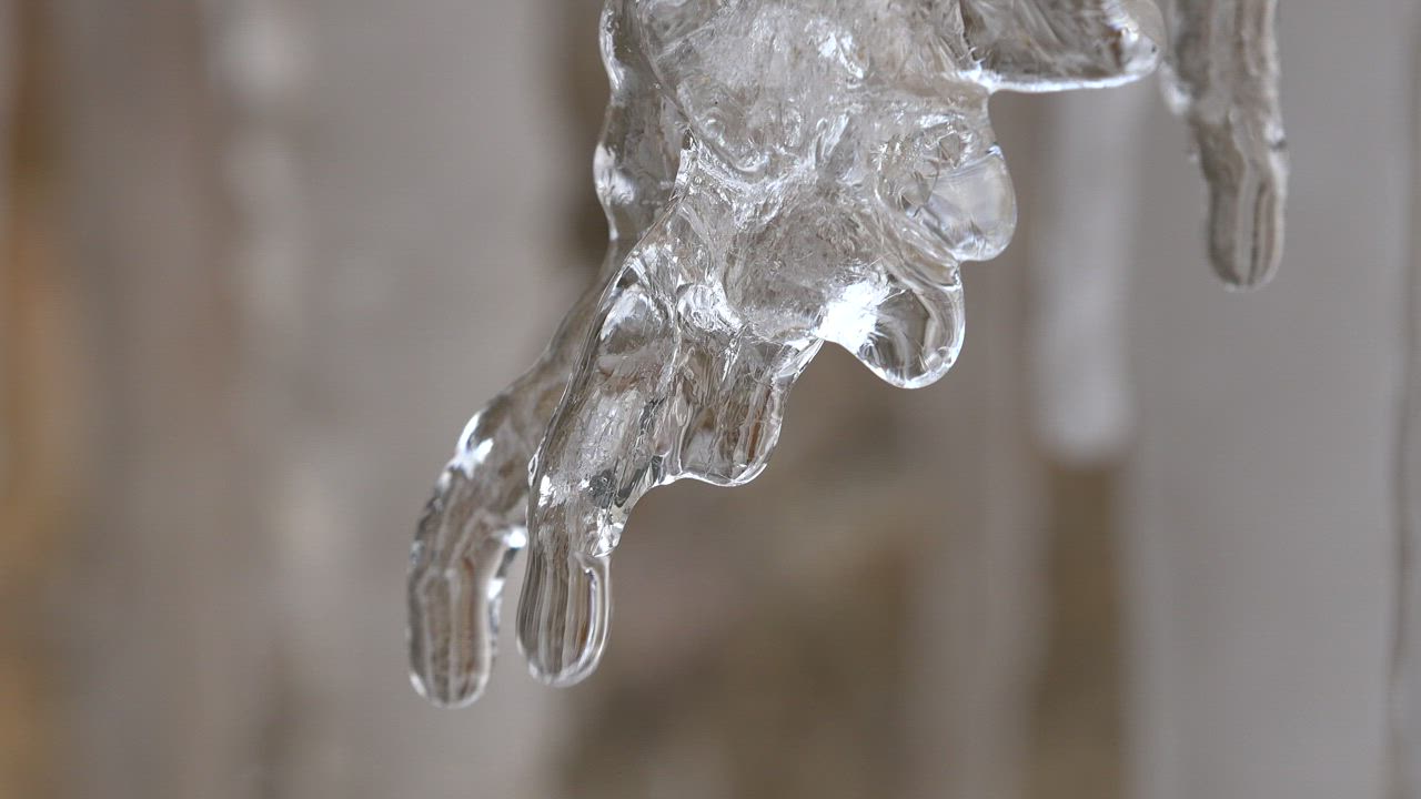 Water dropping from the ice - Free Stock Video