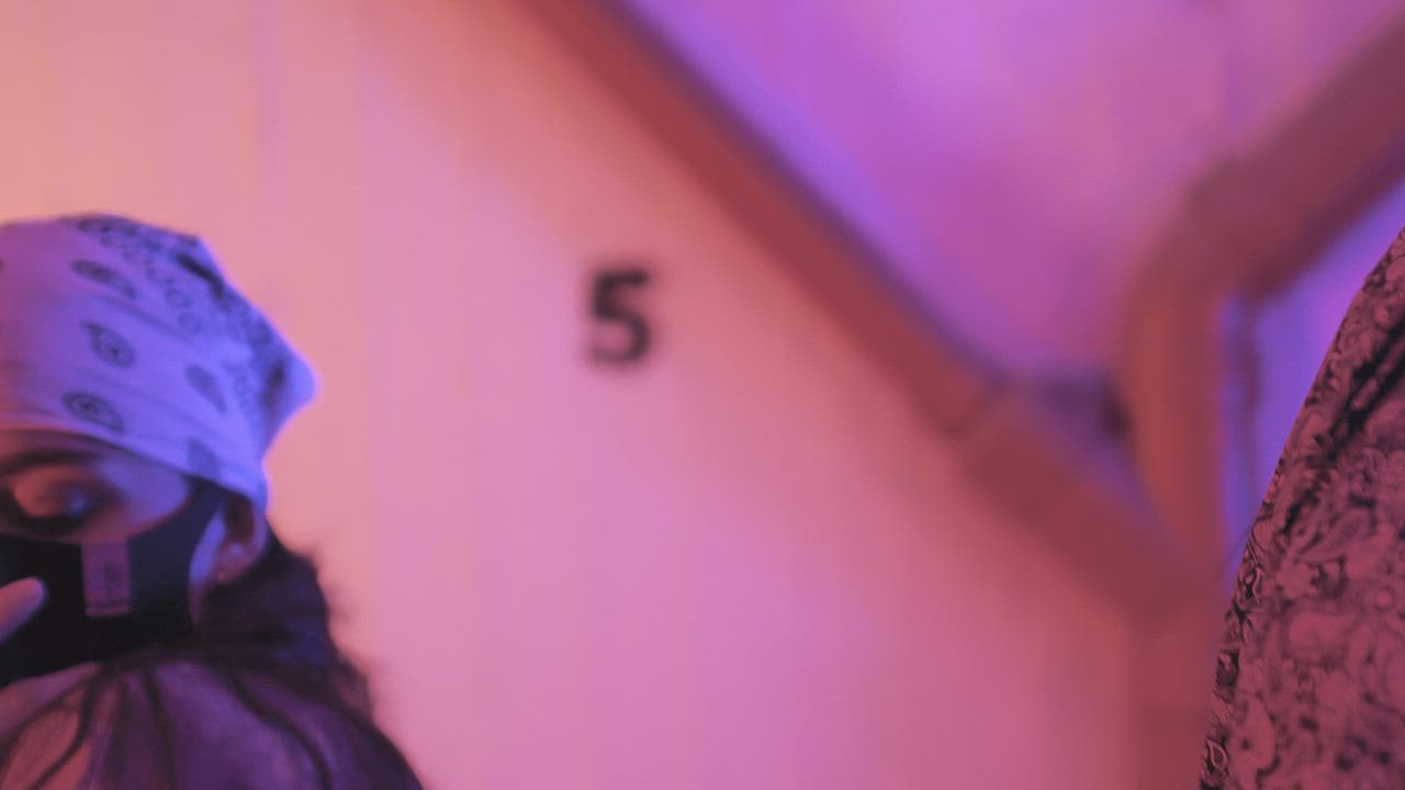 Young woman with a face mask dancing, portrait - Free Stock Video