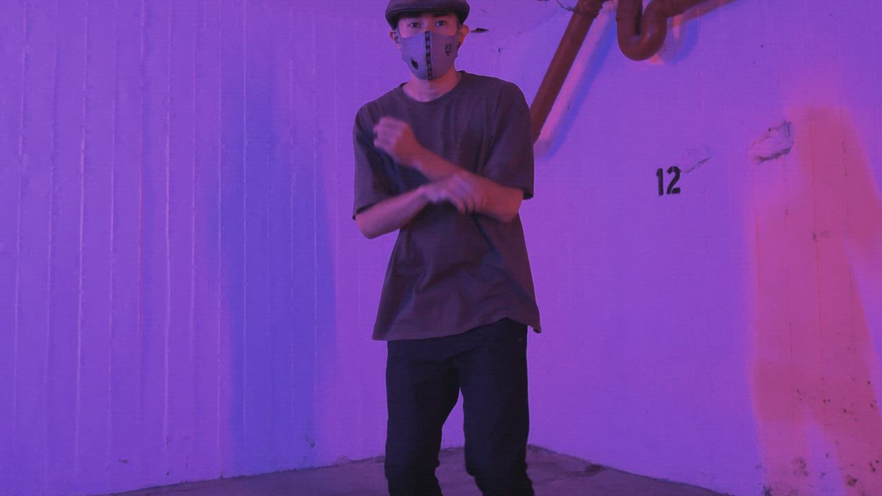 Skillful boy dancing break dance with a face mask - Free Stock Video