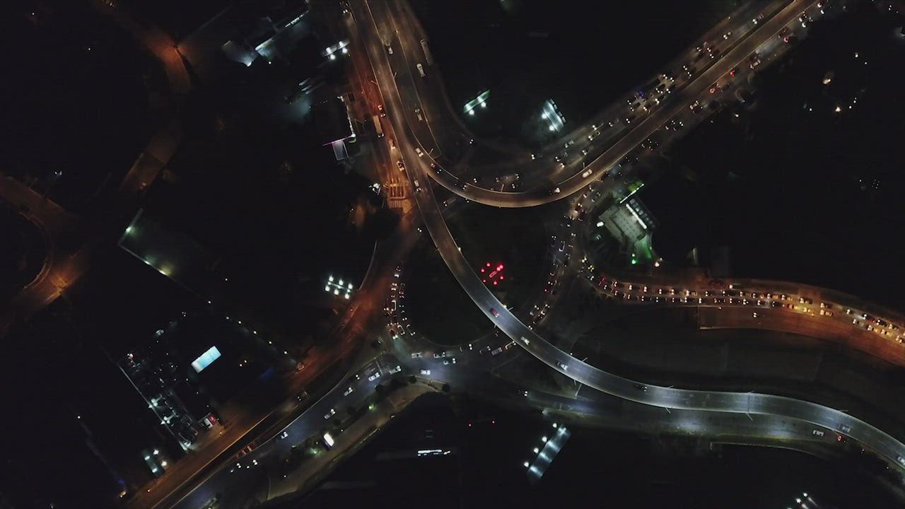 Aerial view of city traffic at night - Free Stock Video