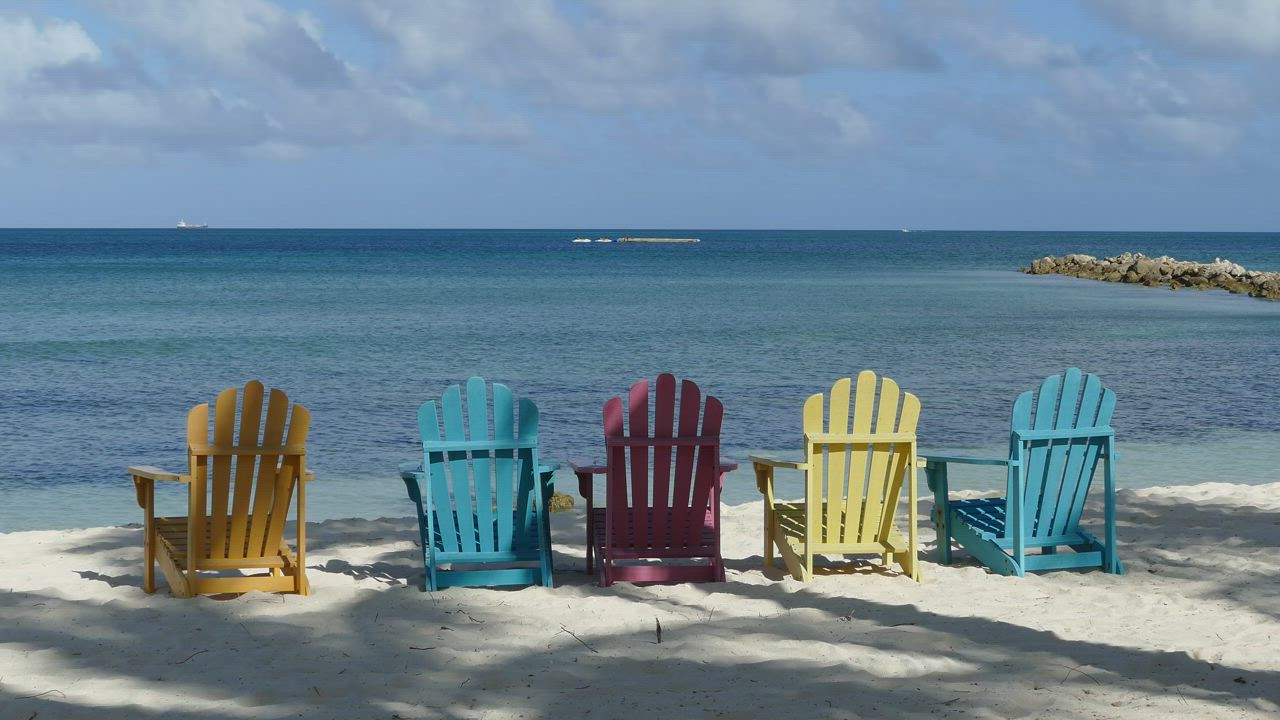 Colorful chairs at the beach - Free Stock Video