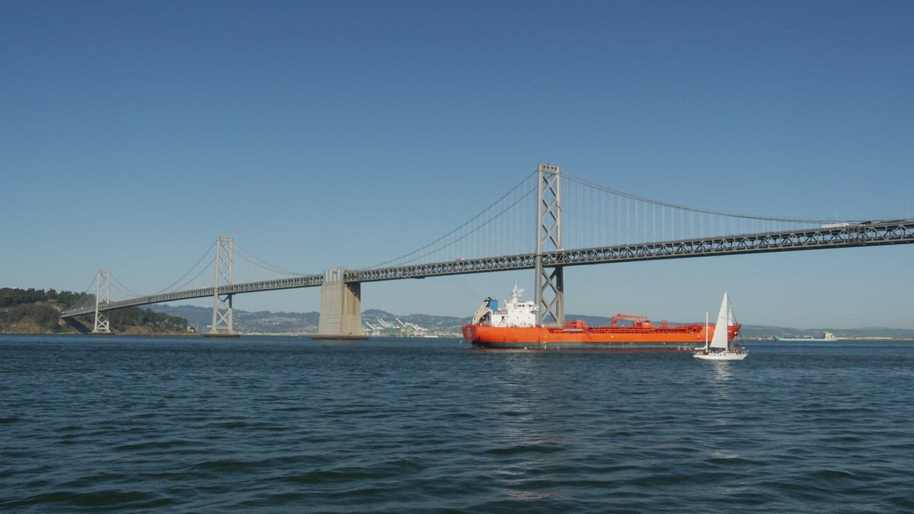 Cargo ship crossing the bridge - Free Stock Video