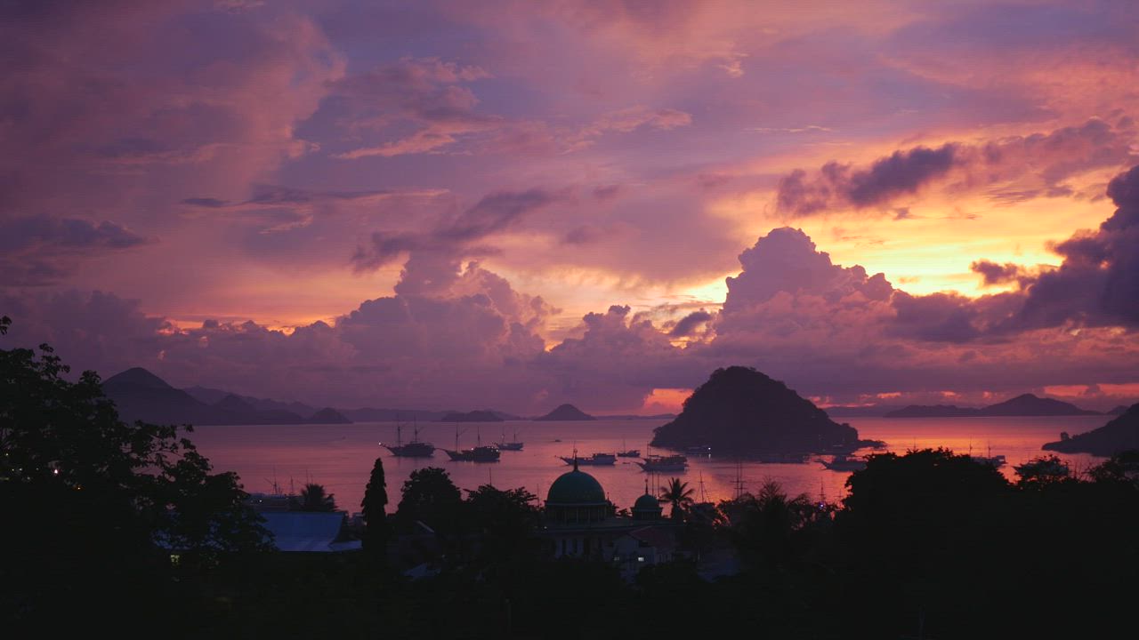 Pink sunset on a tropical landscape - Free Stock Video