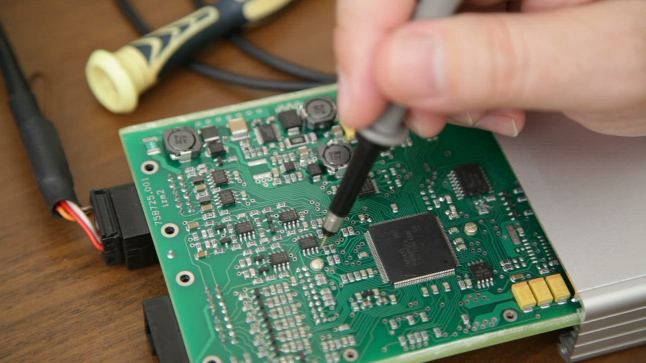 Man working on a circuit board - Free Stock Video