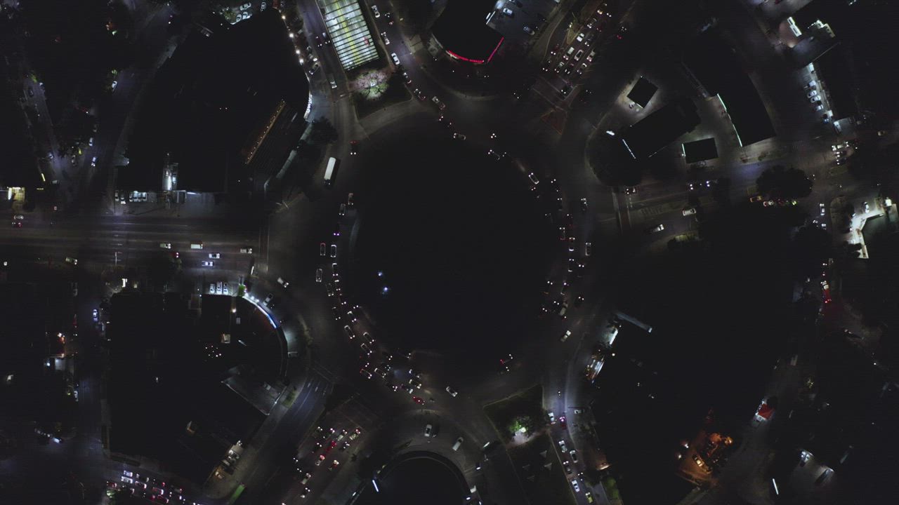 Traffic at a roundabout at night - Free Stock Video