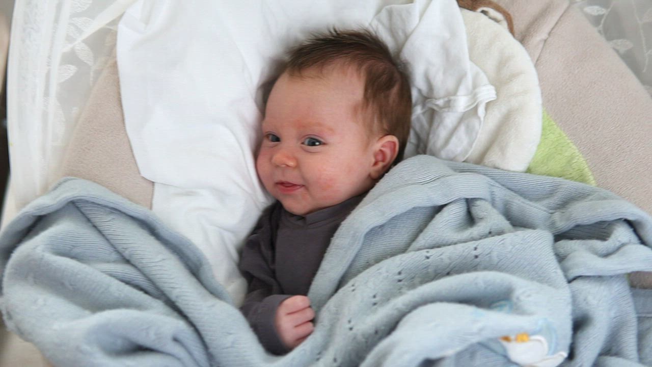 Baby resting in a cradle - Free Stock Video