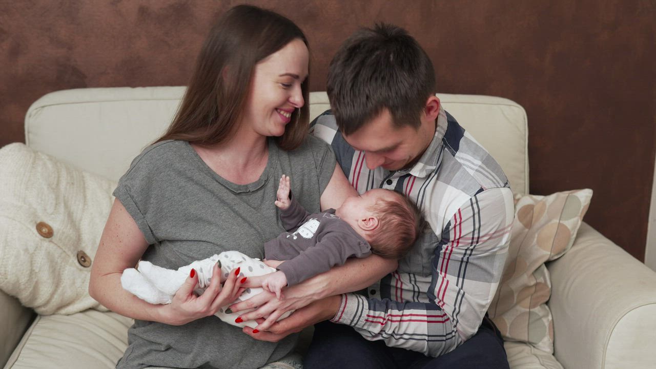 Young couple with their baby - Free Stock Video