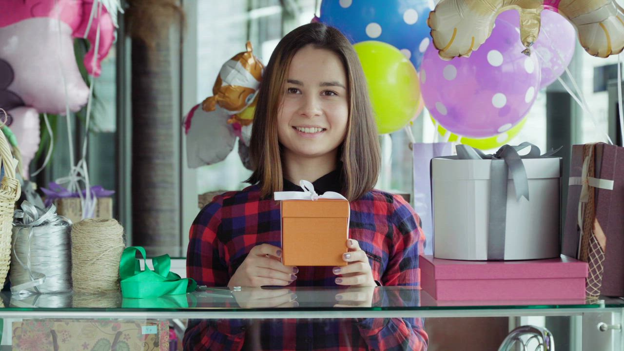 Woman working in a gift shop - Free Stock Video