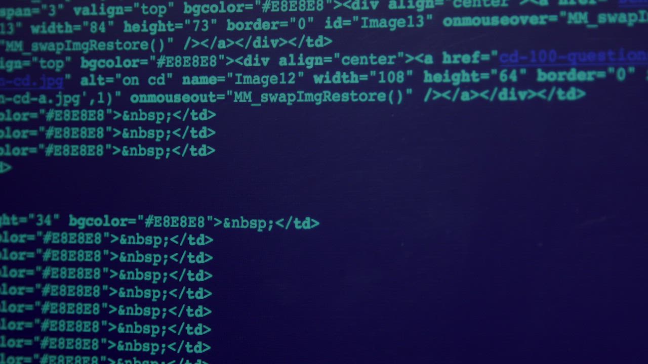 Scrolling blue code on a screen - Free Stock Video