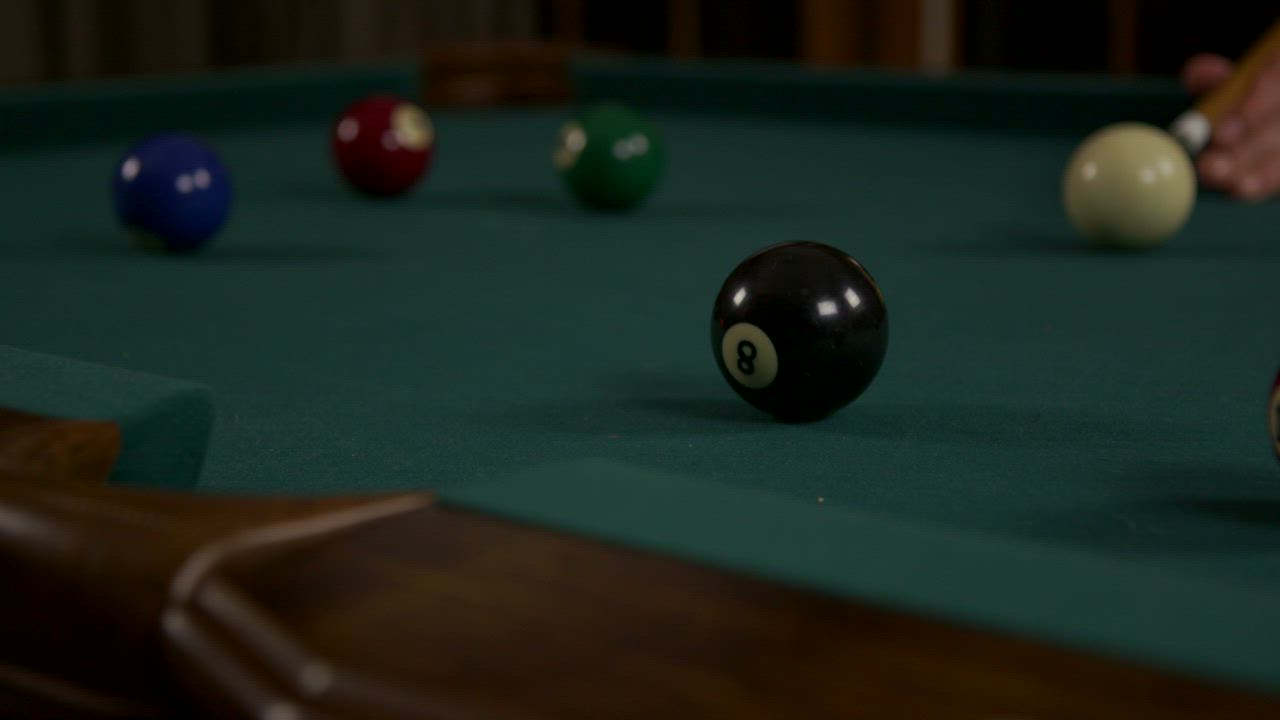 Hitting a ball on a pool table - Free Stock Video