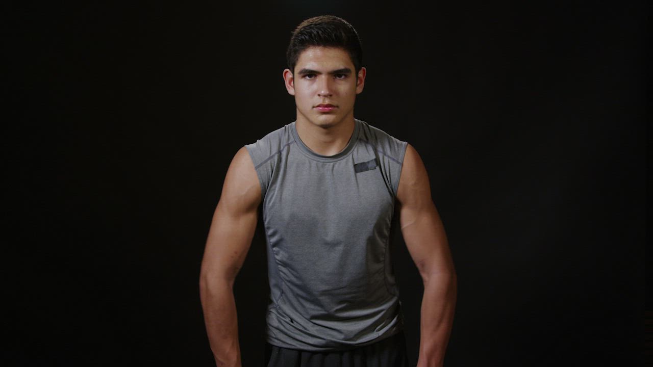 Man lifting weights while standing - Free Stock Video