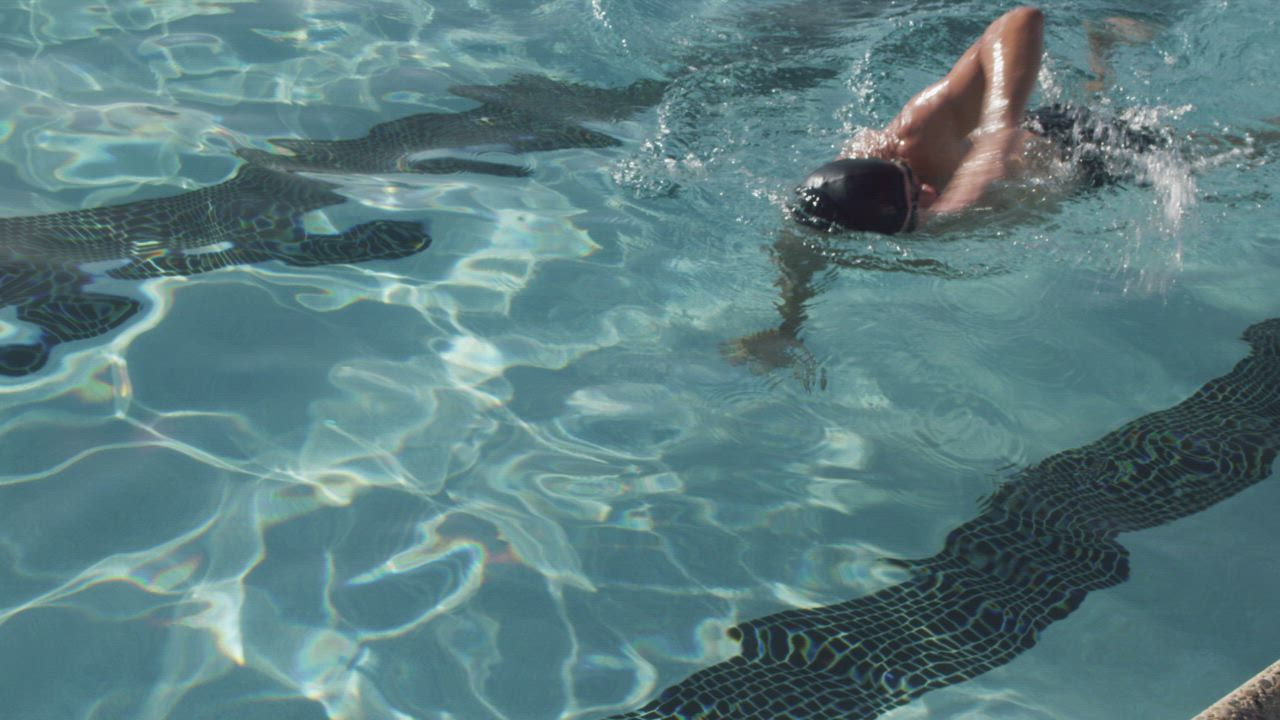 Swimming down a pool lane - Free Stock Video