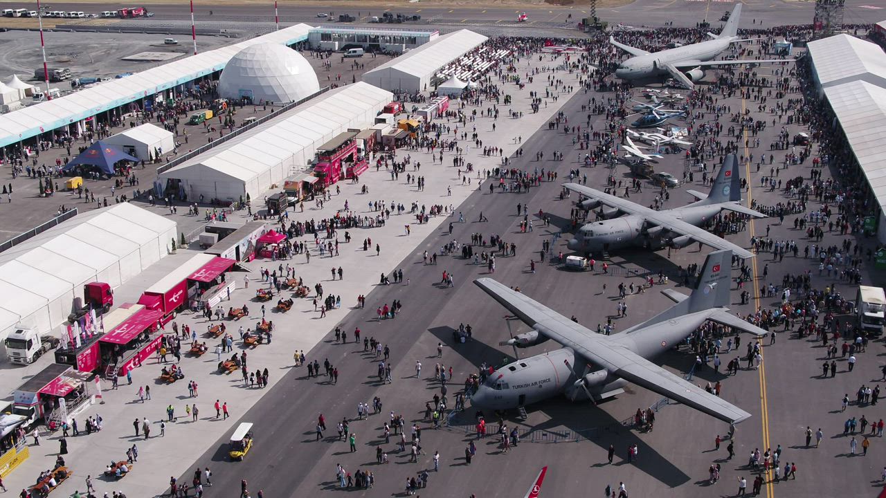 Military aircraft at a festival - Free Stock Video