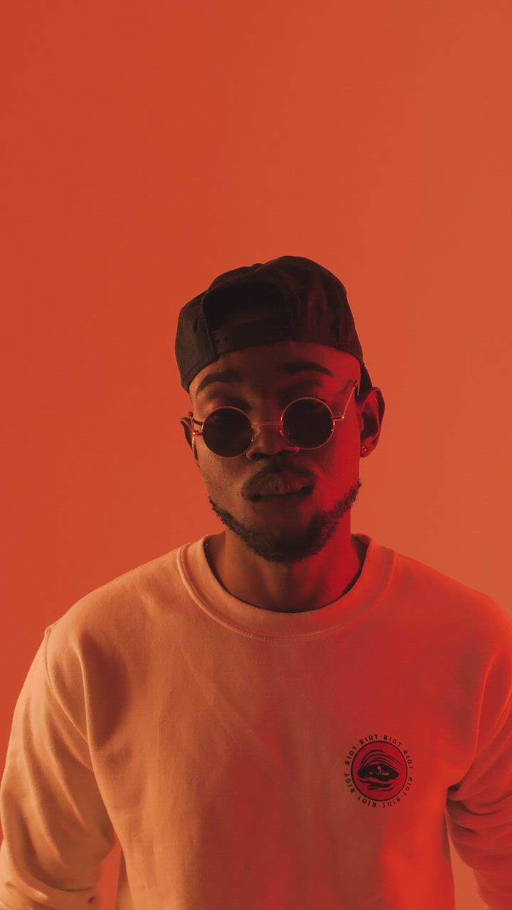 Man under multicolored lights - Free Stock Video