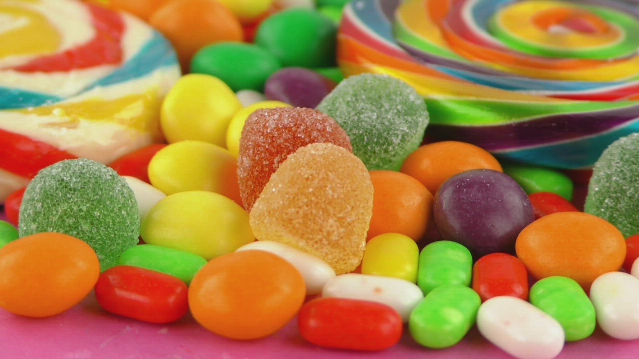 Gums, chewing gum and sweets on a table - Free Stock Video