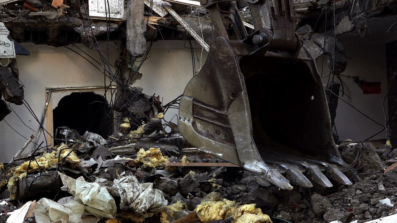 Bulldozer destroying and cleaning the ruins of a building - Free Stock ...