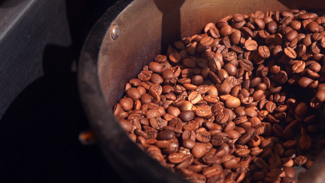 Industrial coffee roaster moving coffee beans - Free Stock Video