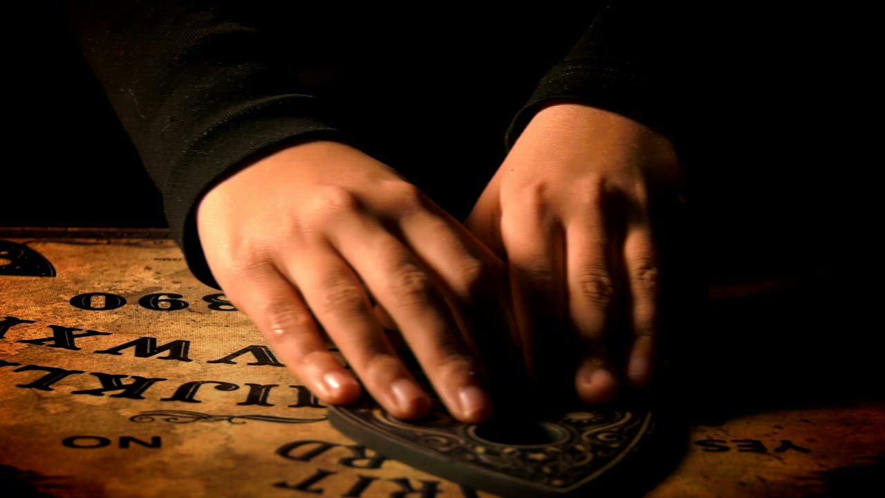 Person playing Ouija board - Free Stock Video