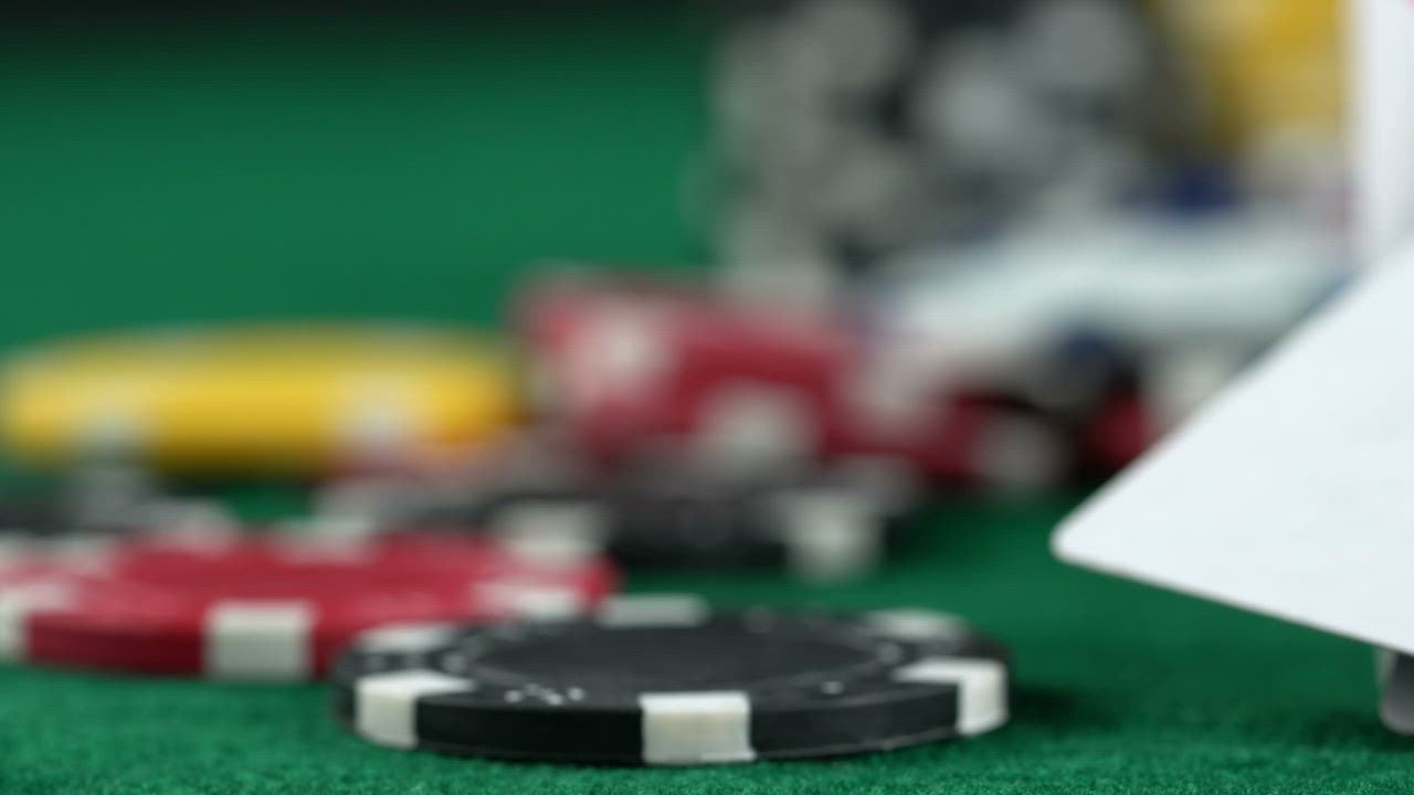 Panning shot of a casino board with dice and poker cards - Free Stock Video
