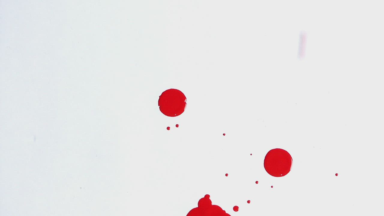 Drops of blood falling on a white surface - Free Stock Video