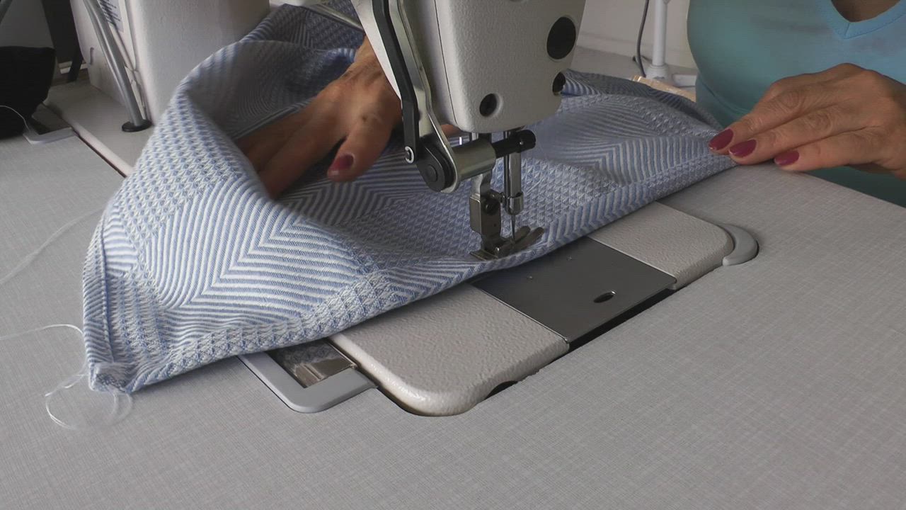 Sewing a dress on machine, close up - Free Stock Video