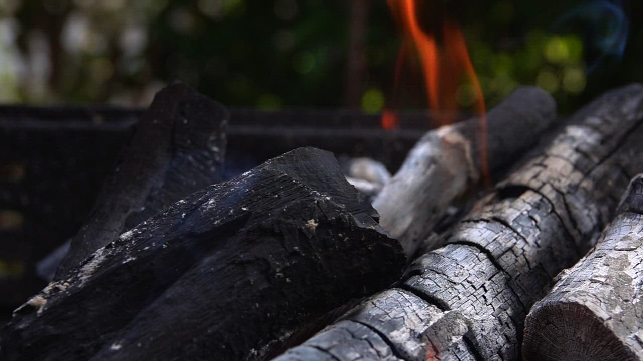 Coal covered in ash on a roast - Free Stock Video