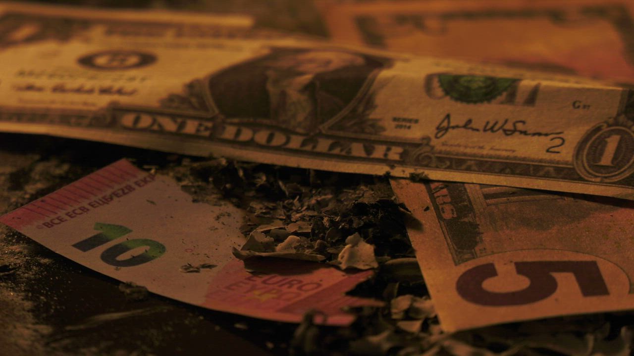 Money on fire covered in ash - Free Stock Video