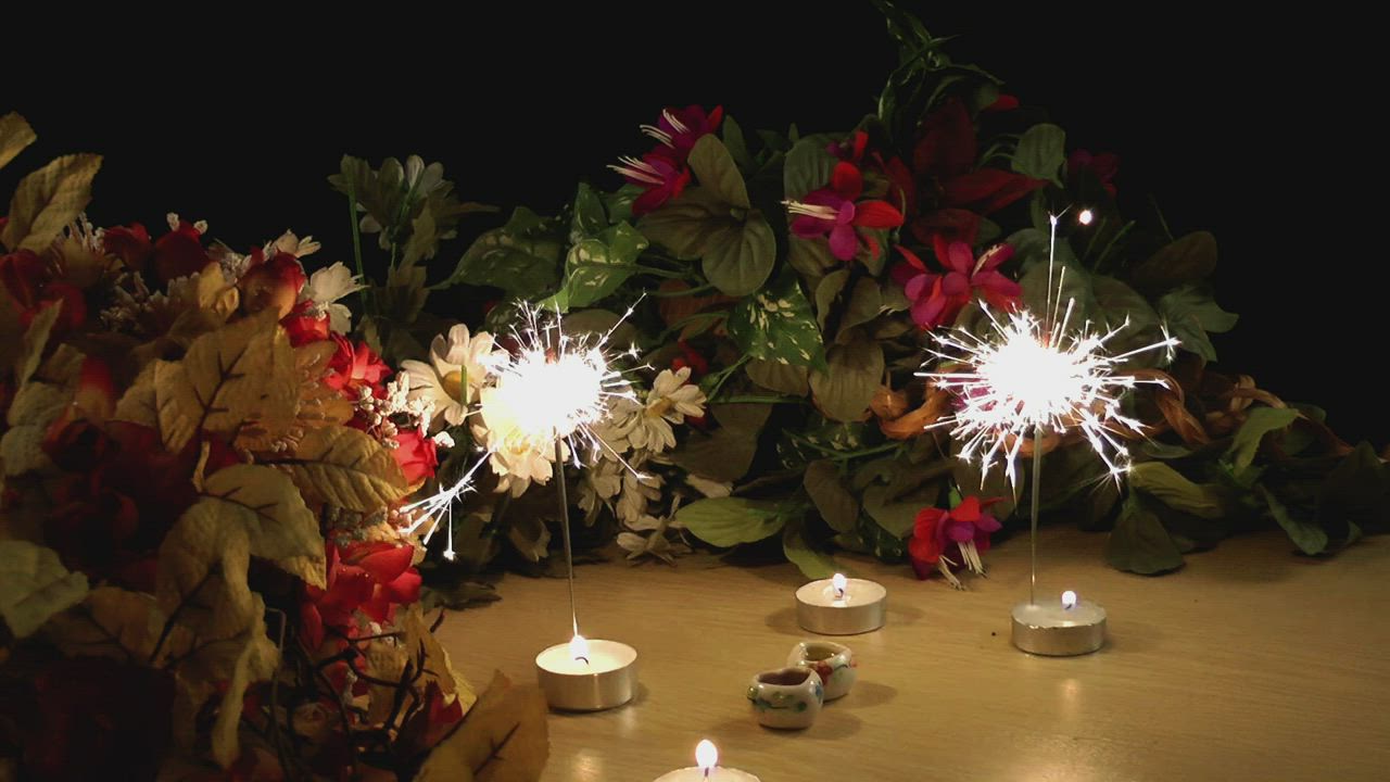 Birthday ornament: Candles, flares and flowers - Free Stock Video