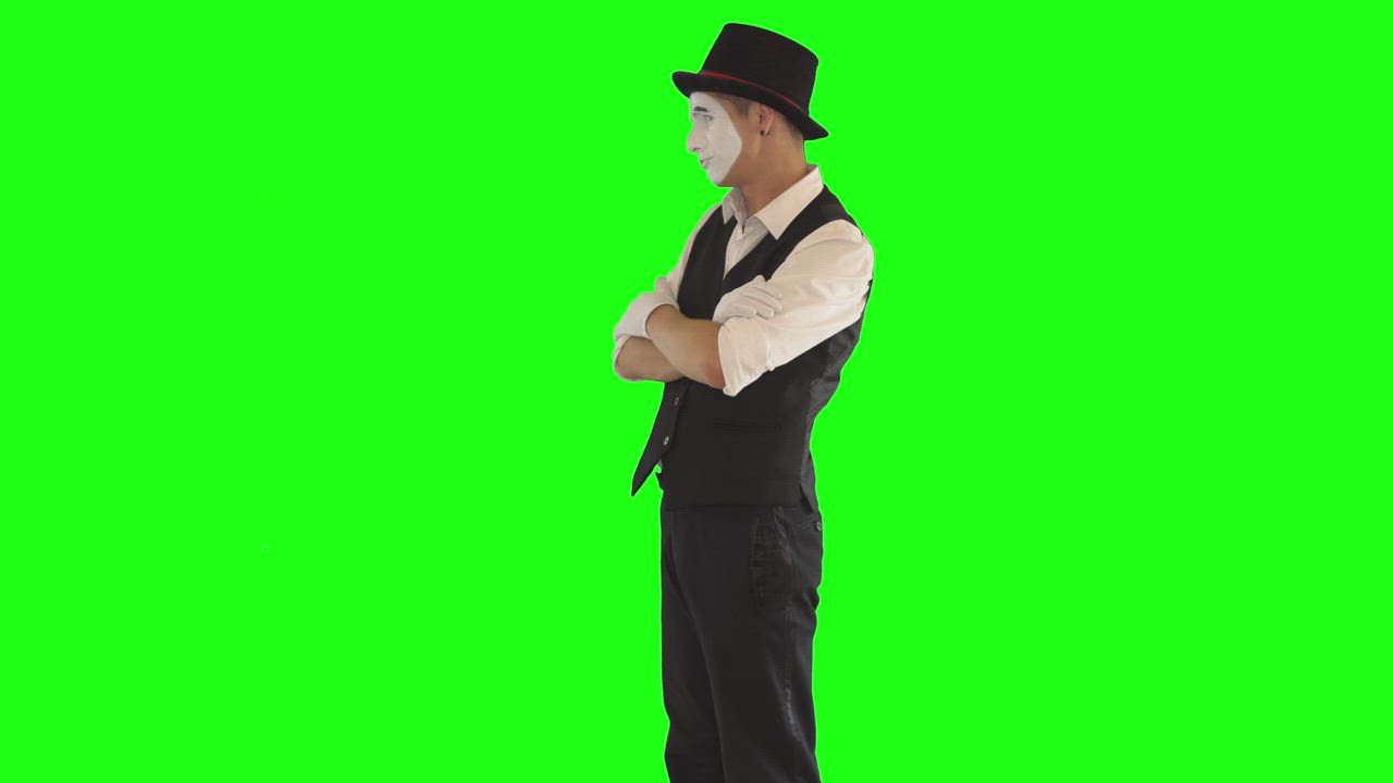 Mime flexes muscles on green screen - Free Stock Video